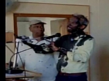 Progressive writer's face smeared with black ink