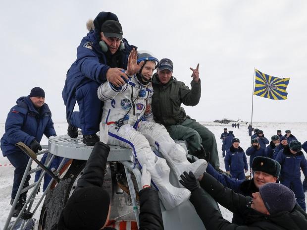 Three astronauts return from International Space Station after 197 days