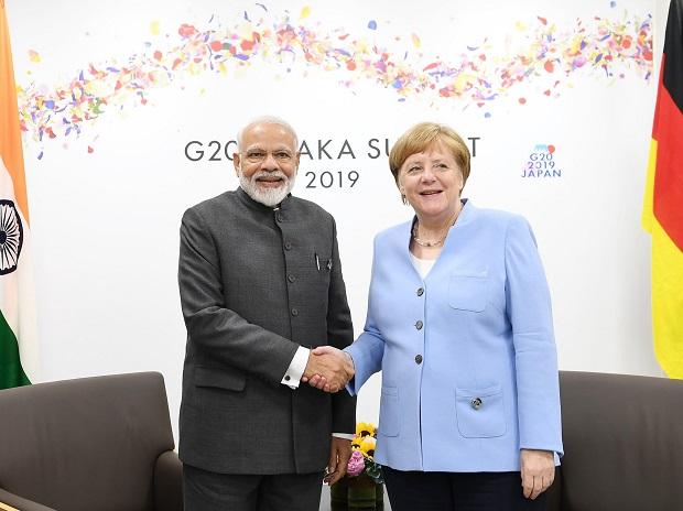 PM Modi meets Angela Merkel, discusses ways to deepen Indo-German ...