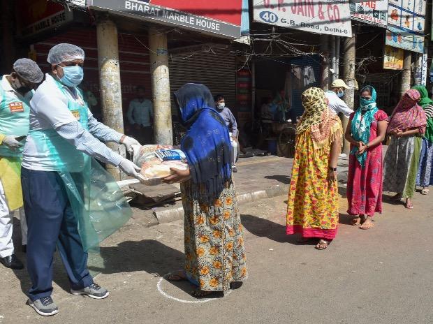 In pics: From politicians to common man, Indians practice social ...