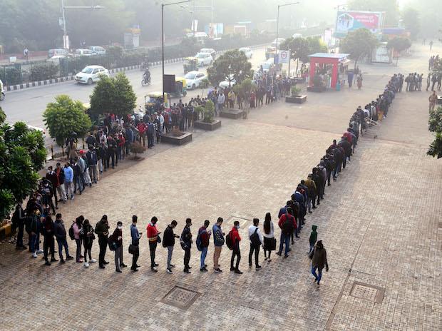 Long queues outside many stations as DMRC trains run with new Covid ...
